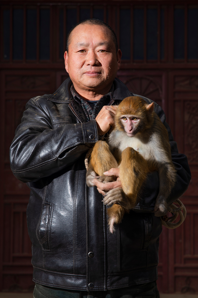Lihua Han - The portrait of the monkey charmer | LensCulture